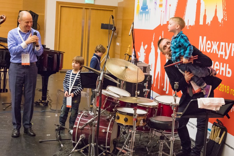 Drummer Oleg Butman conducts a workshop with young students as part of ...
