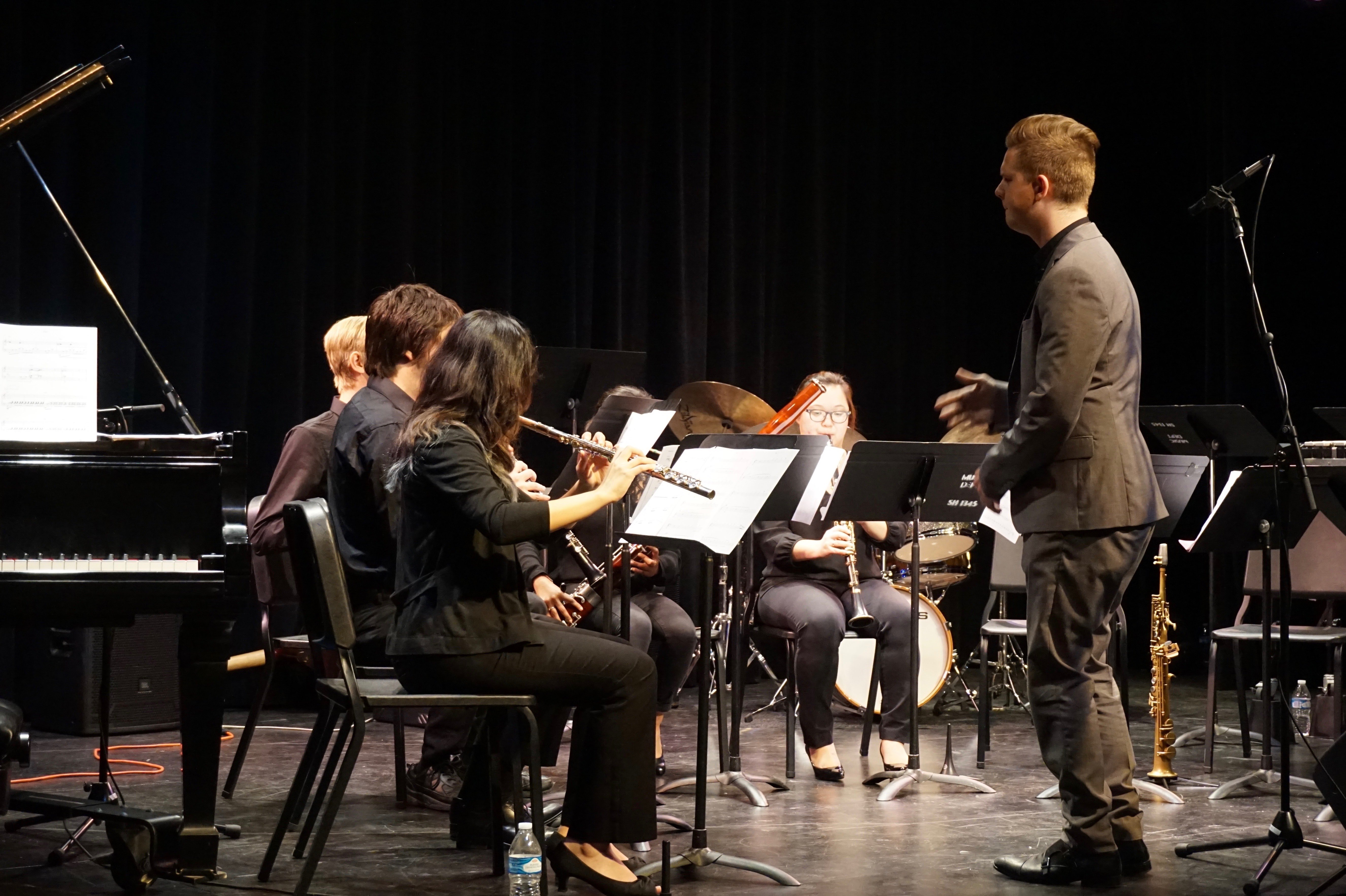 Saxophonist Alex Hahn (Class of 2018) conducts his original composition ...