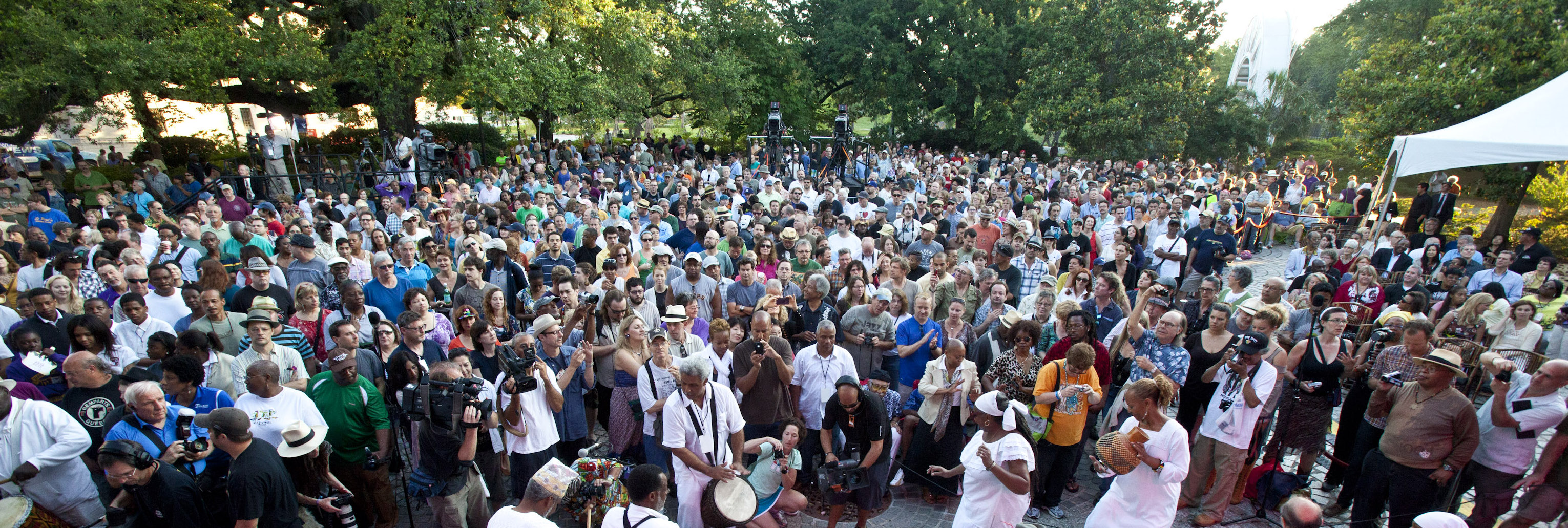 Crowd shot with media stand and VIP seating area - Hancock Institute of ...