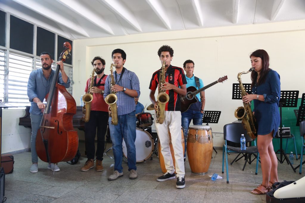 Saxophonist Melissa Aldana conducts a saxophone workshop with students ...